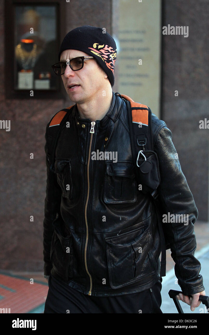 Sam Rockwell out and about in Beverly Hills pulling wheeled luggage Los ...