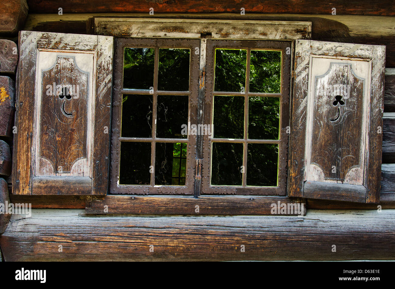 Decorative window of wooden cabin Stock Photo - Alamy