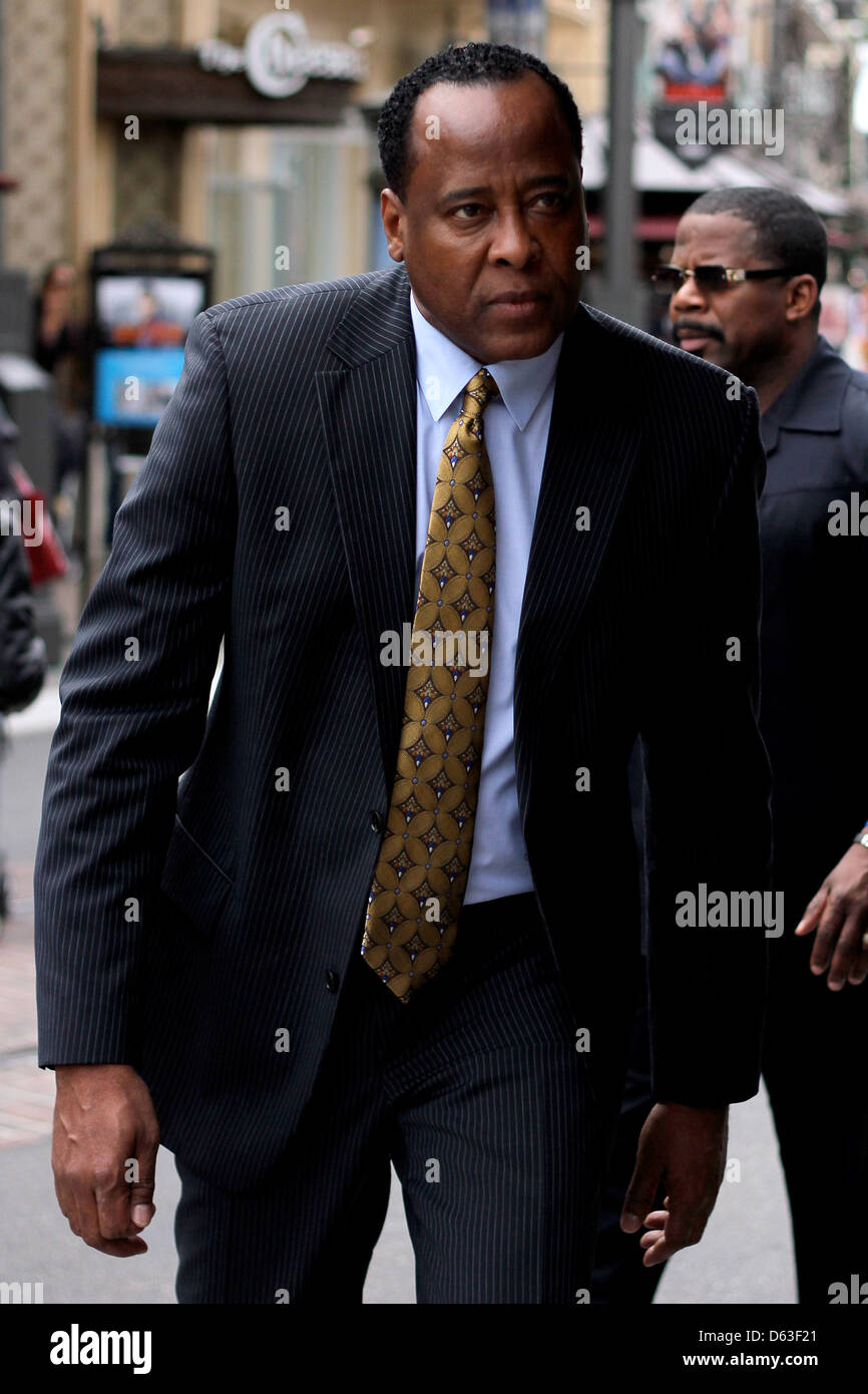 Dr. Conrad Murray wearing a suit as he walks around The Grove in ...