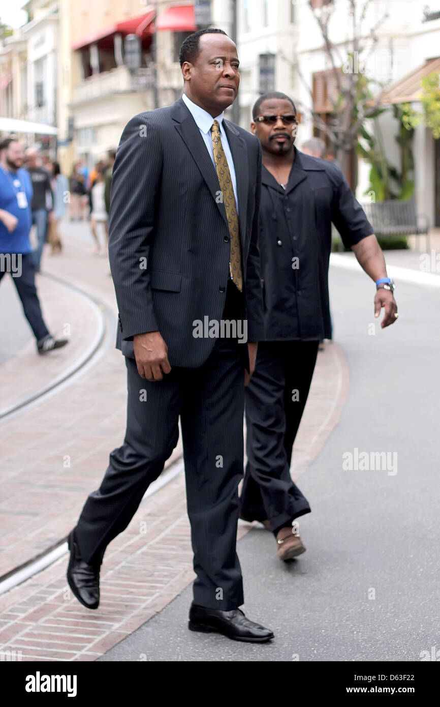 Dr. Conrad Murray wearing a suit as he walks around The Grove in ...