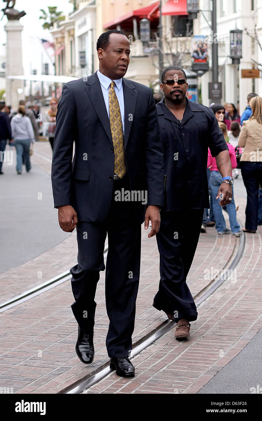 Dr. Conrad Murray wearing a suit as he walks around The Grove in ...