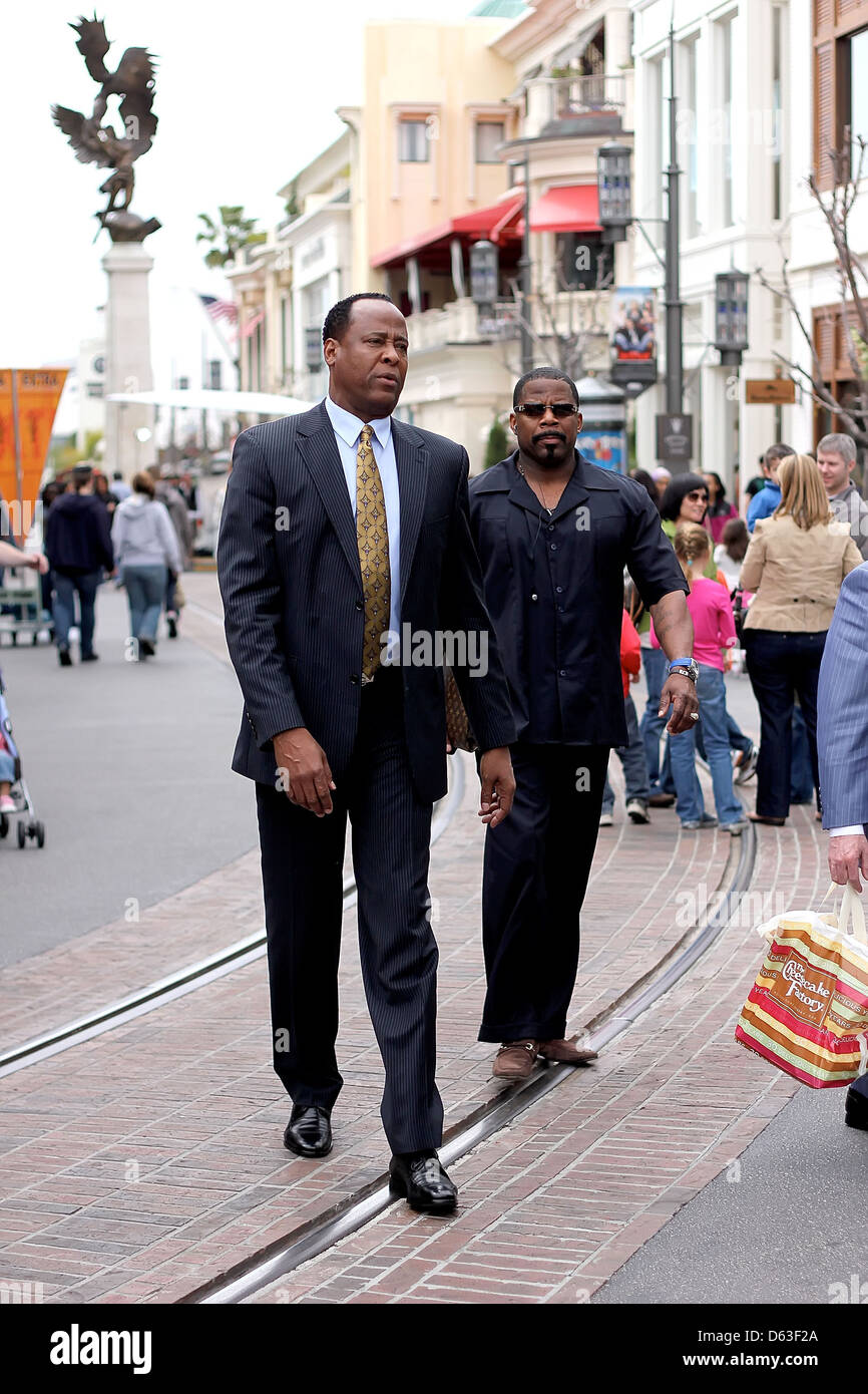 Dr. Conrad Murray wearing a suit as he walks around The Grove in ...