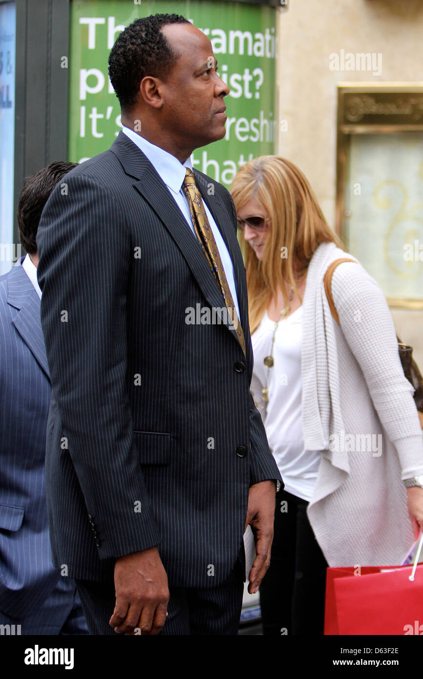 Dr. Conrad Murray wearing a suit as he walks around The Grove in ...