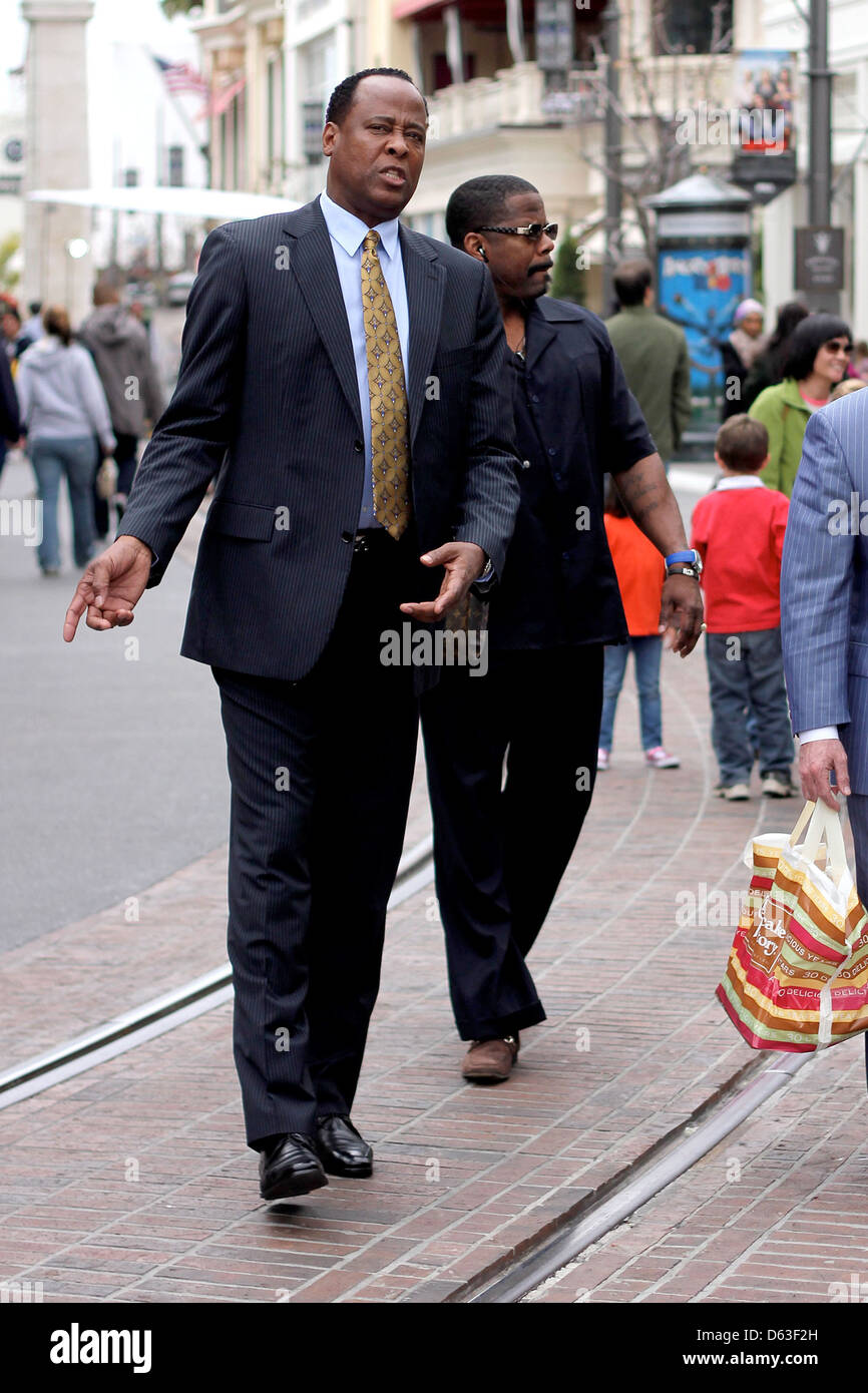 Dr. Conrad Murray wearing a suit as he walks around The Grove in ...