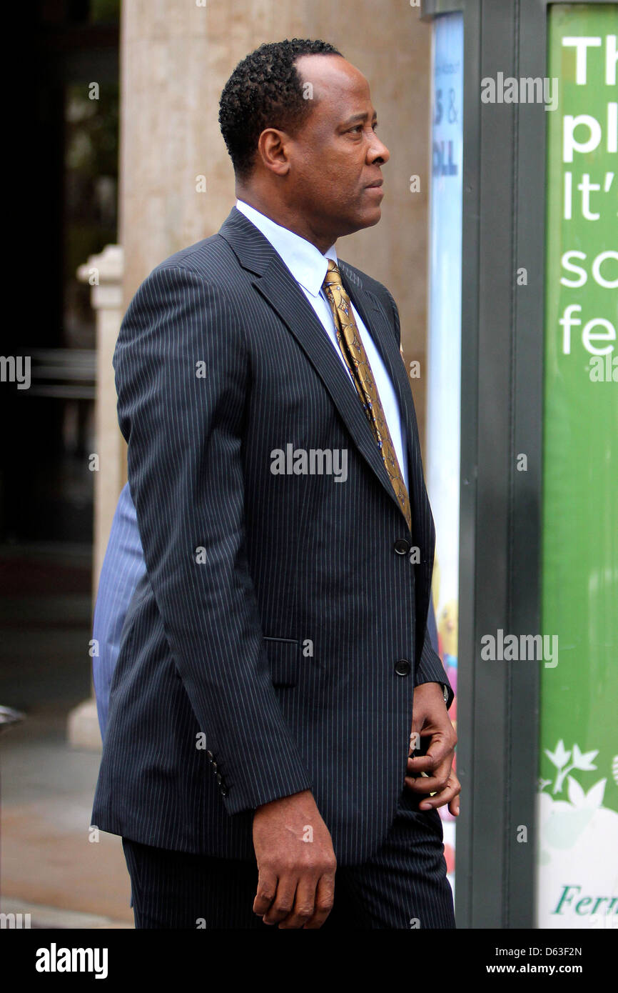 Dr. Conrad Murray wearing a suit as he walks around The Grove in ...