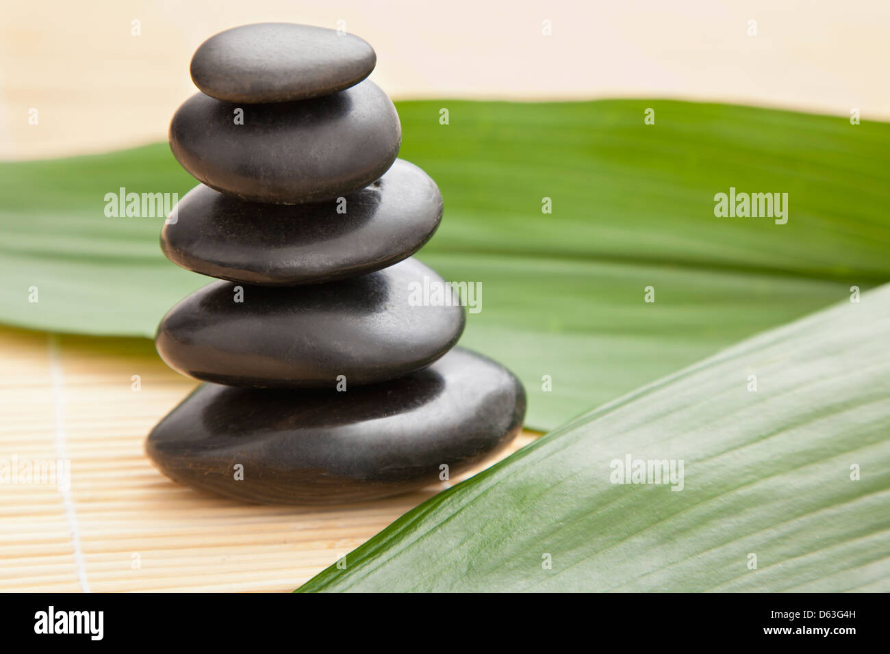 Stack of lastone therapy stones in spa, Studio shot Stock Photo - Alamy