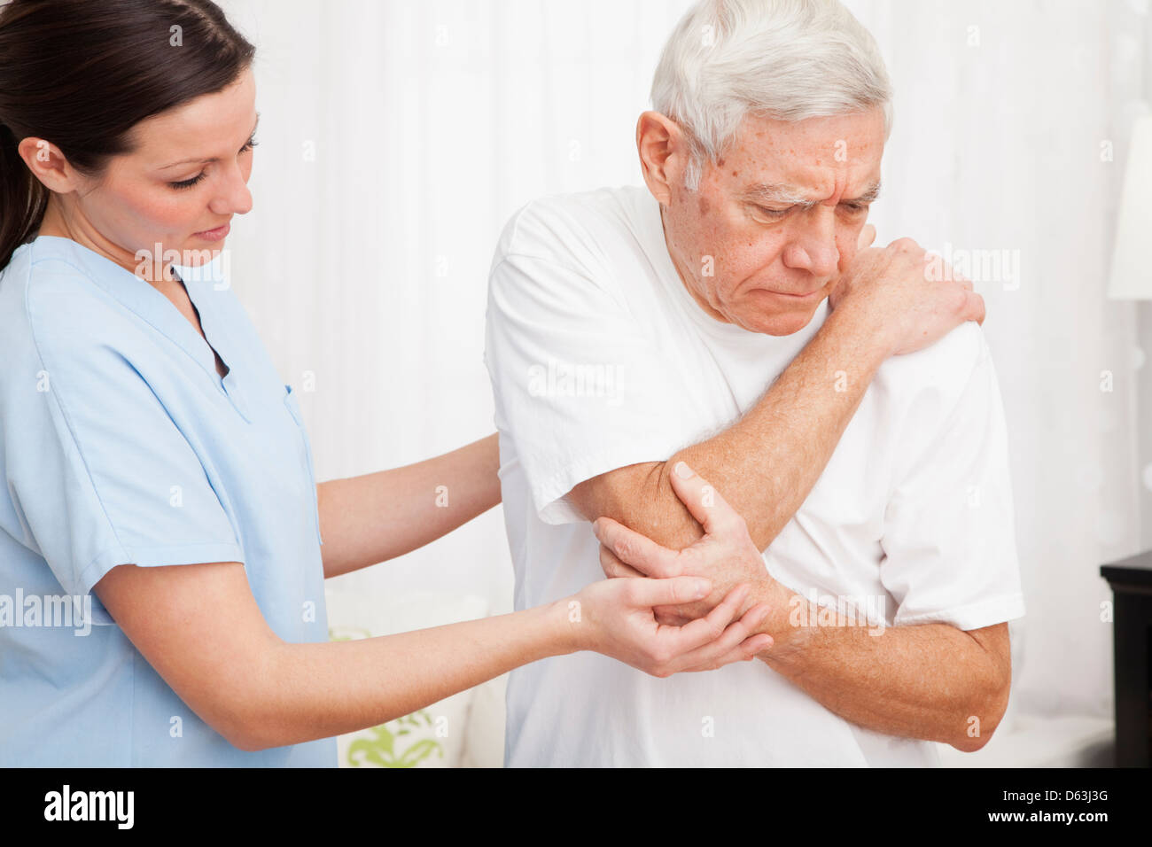 Nurse helping patient Stock Photo - Alamy