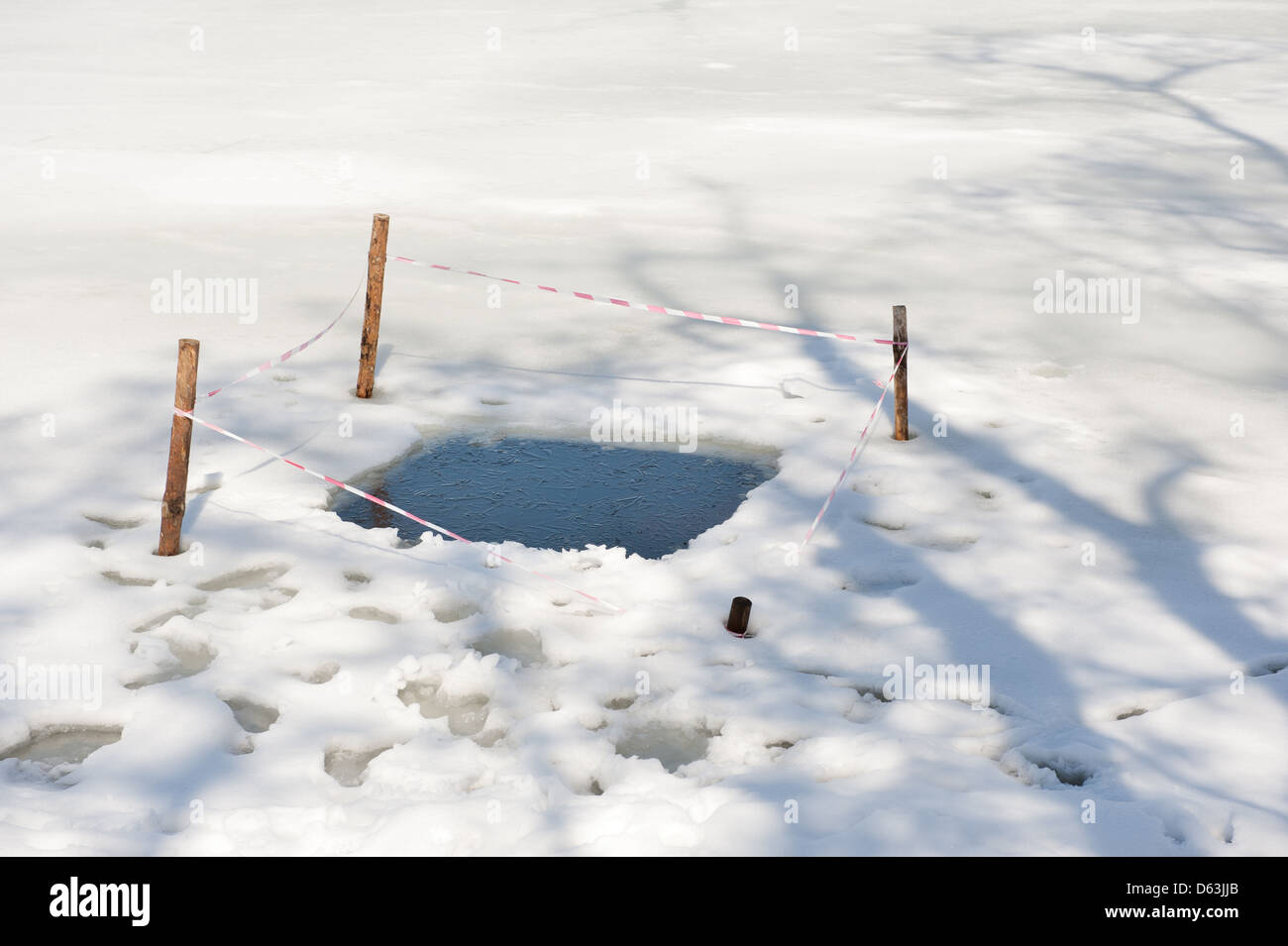 ice hole and melting snow at the lake Stock Photo - Alamy