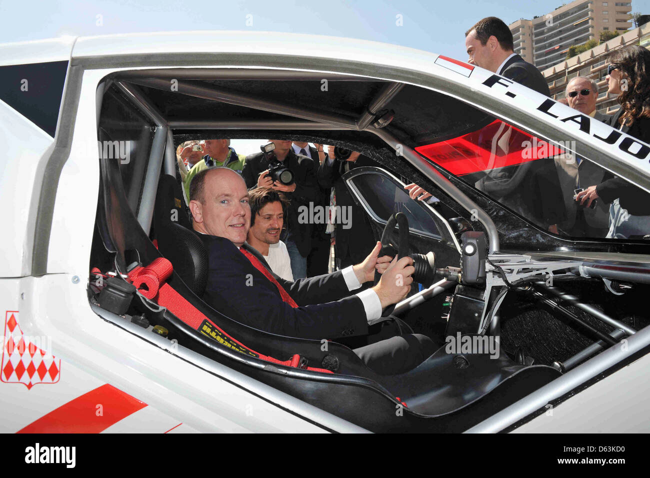 Prince Albert II of Monaco is presented an electric race car during the ...