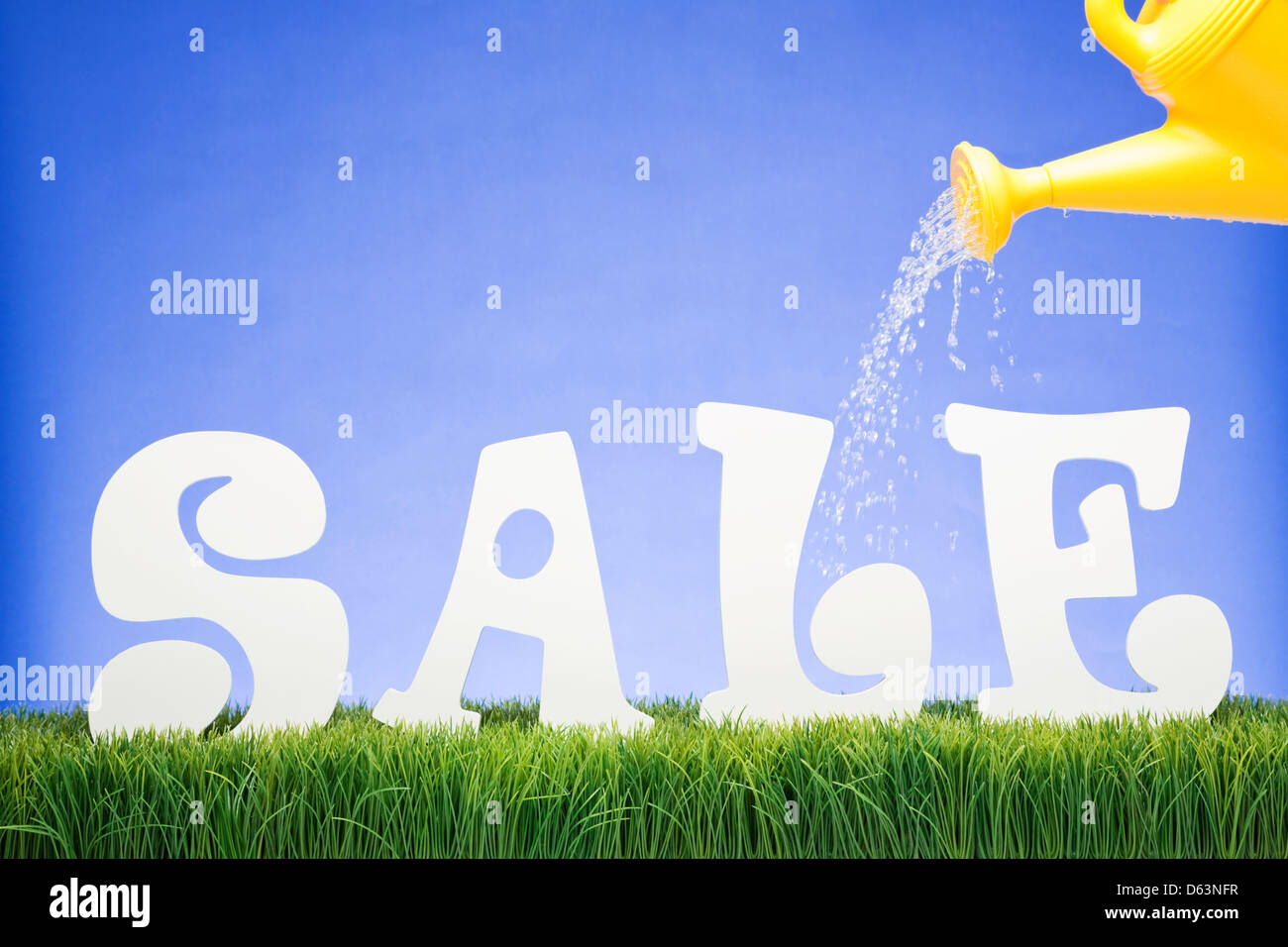 Pouring water over the sale sign Stock Photo - Alamy
