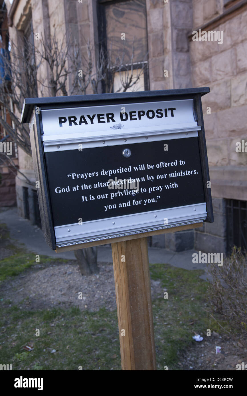 Sign in front of church encourages parishioners to deposit written ...