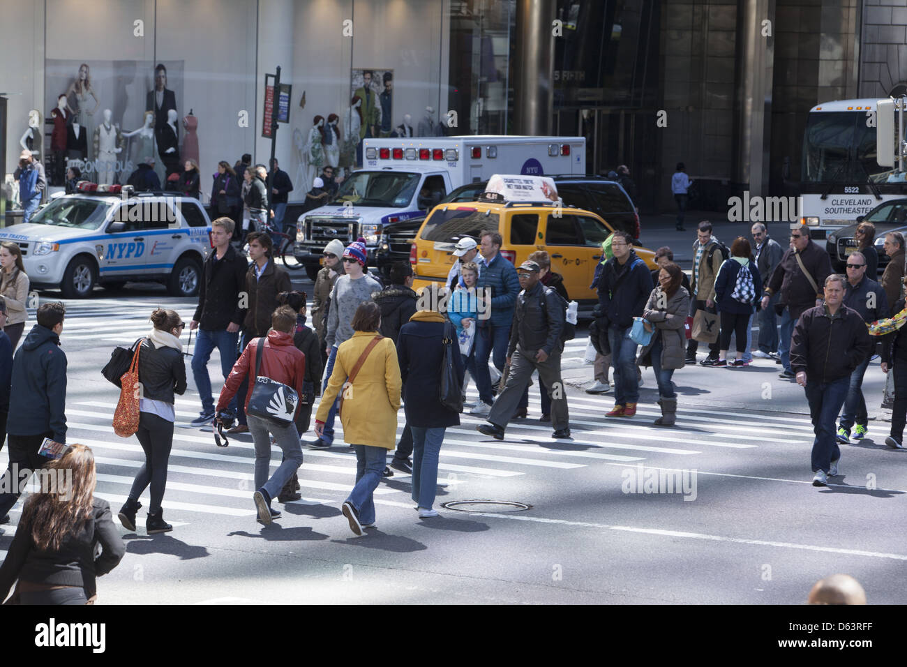 People cross the street at 5th Avenue and 42nd Street, NYC Stock Photo ...