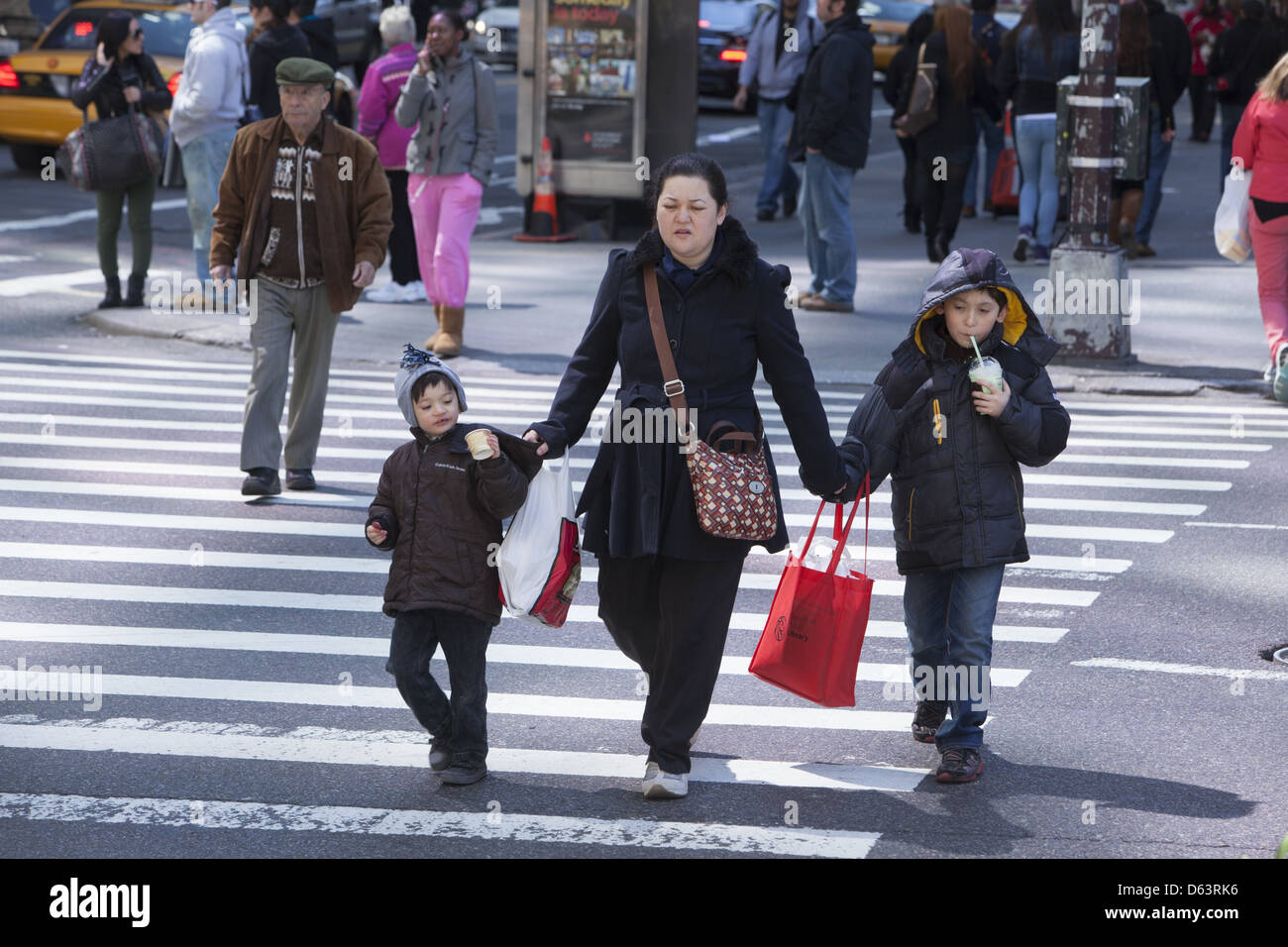 People cross the street at 5th Avenue and 42nd Street, NYC Stock Photo ...