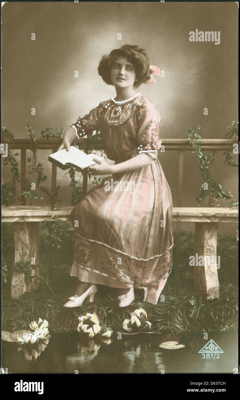 Old Swiss postcard 1917. Shows a girl with book Stock Photo - Alamy