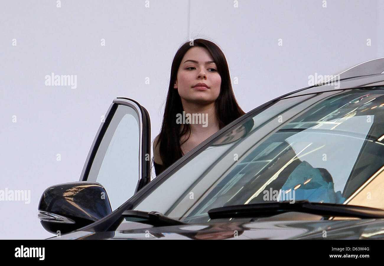 Miranda Cosgrove departs Kitson on Melrose Avenue with two large shopping bags Los Angeles ...