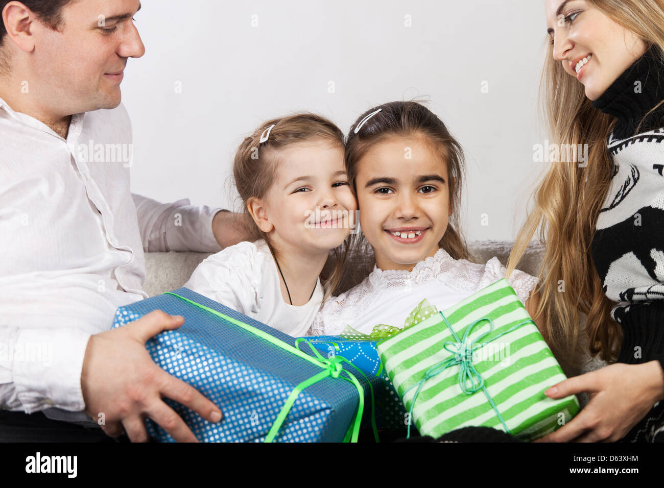 Happy family with presents Stock Photo - Alamy