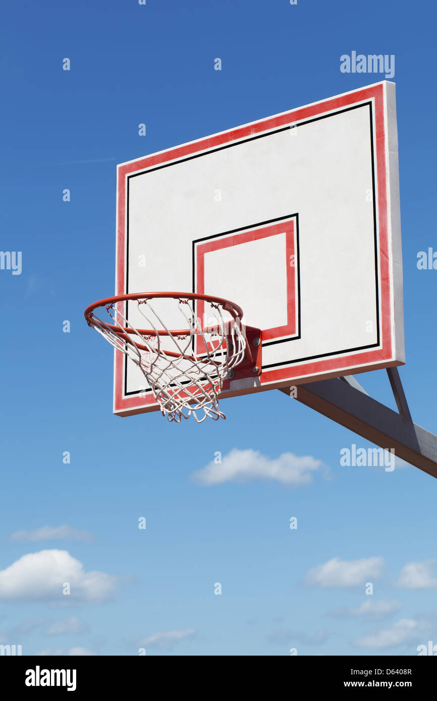 Basketball hoop on blue sky background Stock Photo - Alamy