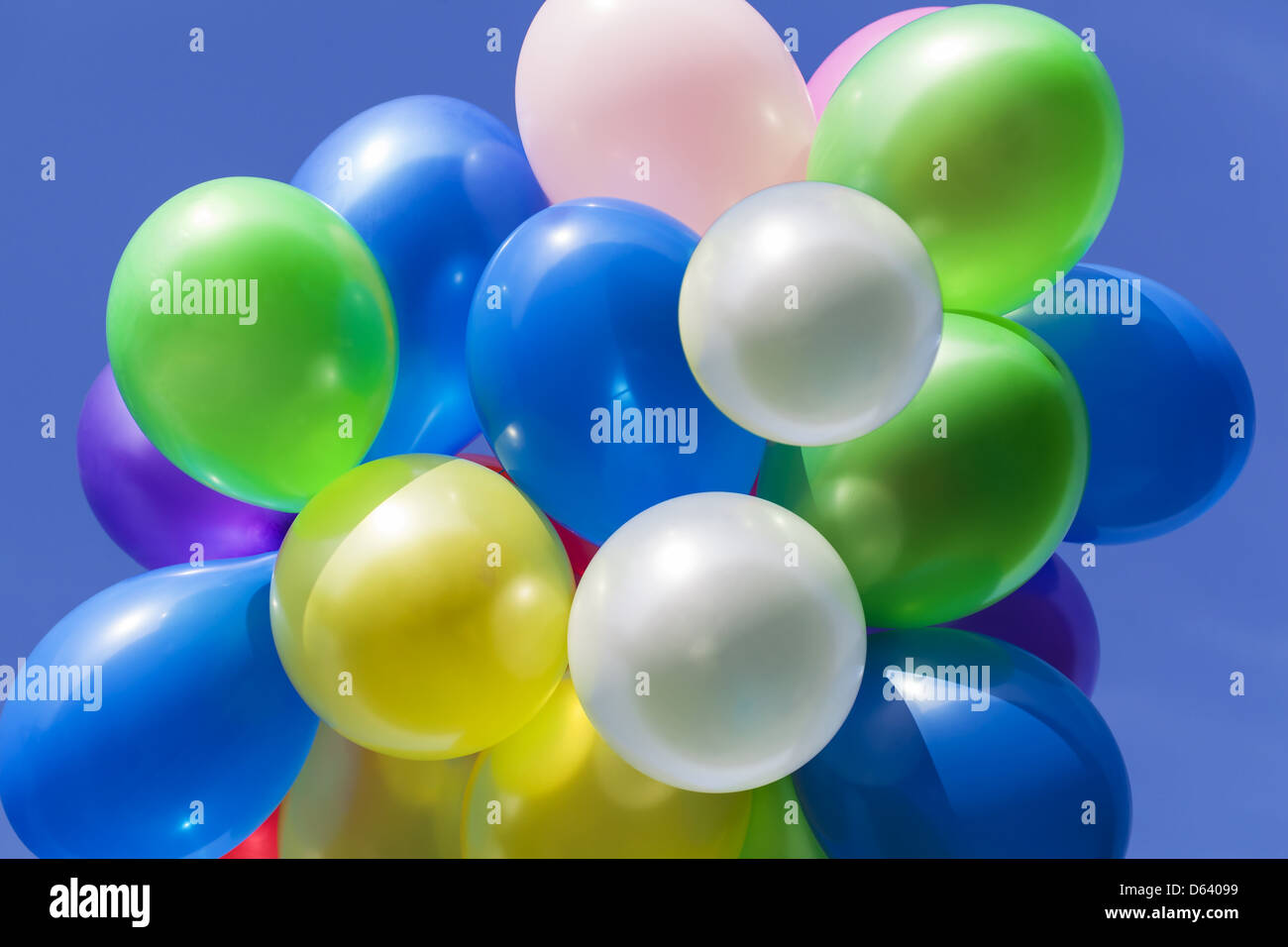Different coloured balloons in the sky near Stock Photo - Alamy