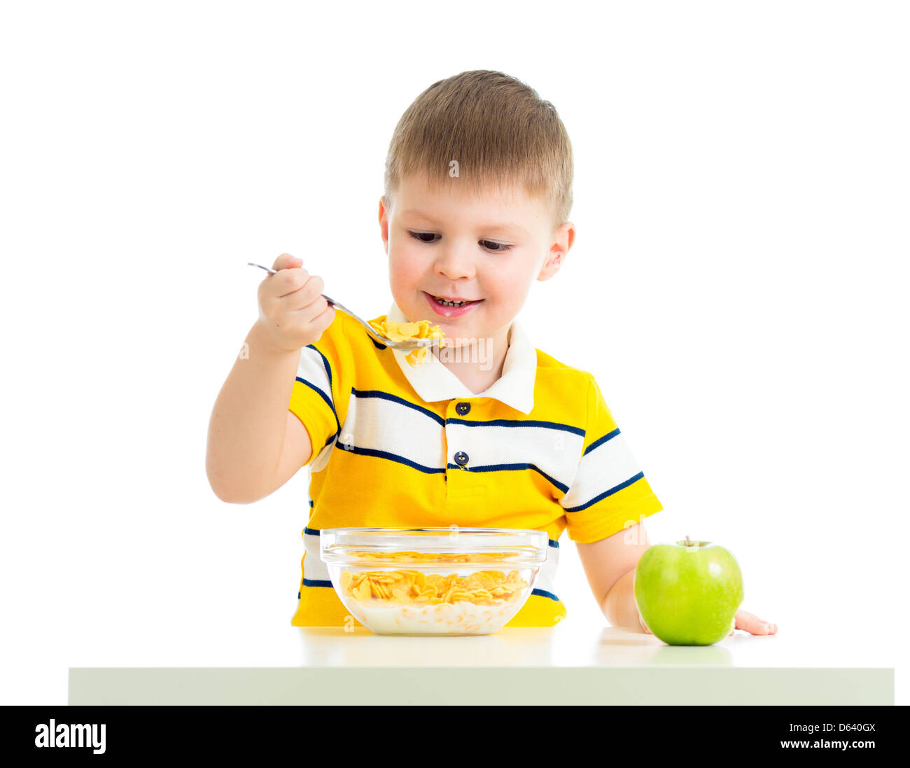 kid boy eating corn flakes with milk Stock Photo - Alamy
