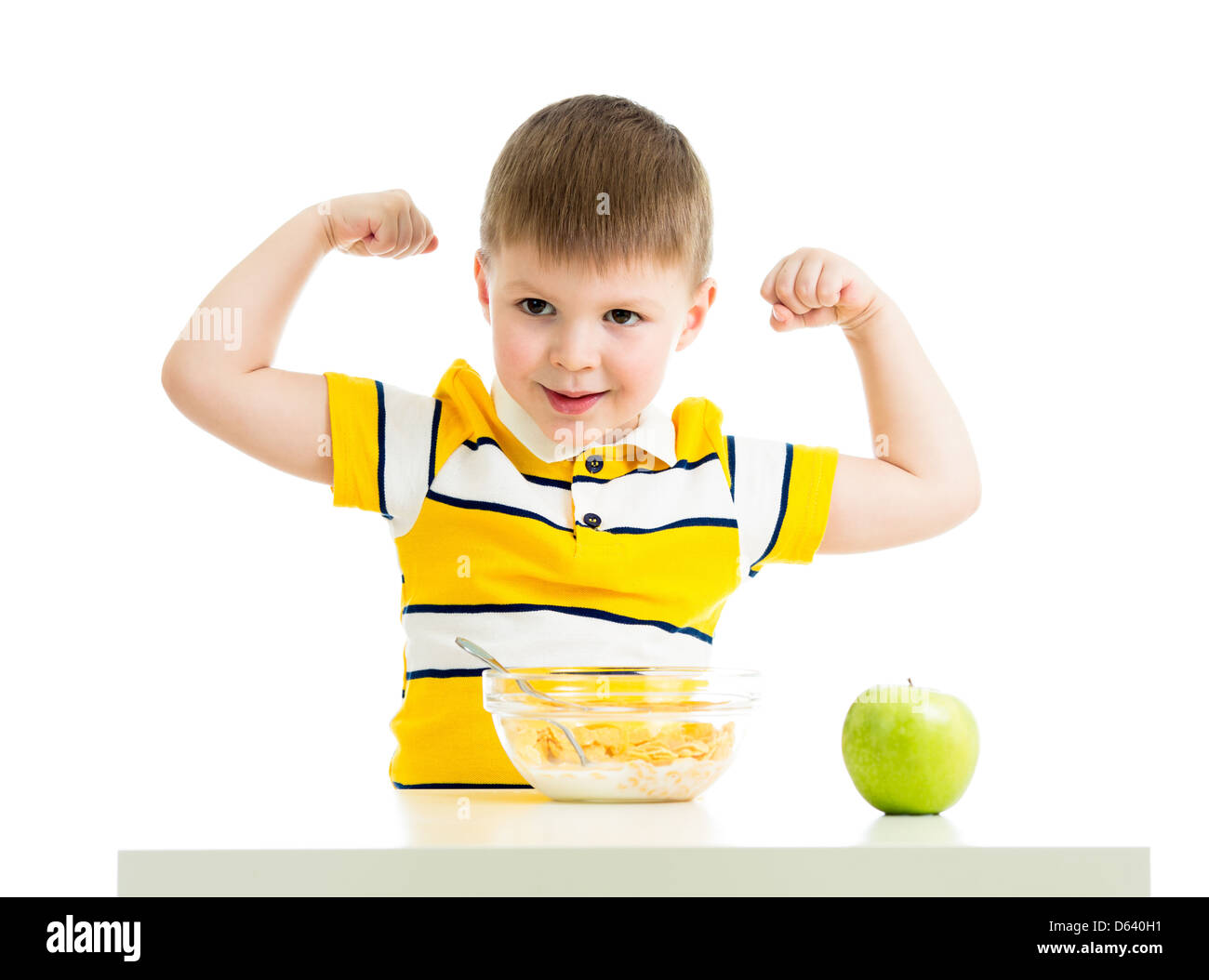 kid boy eating healthy food and showing strength Stock Photo - Alamy