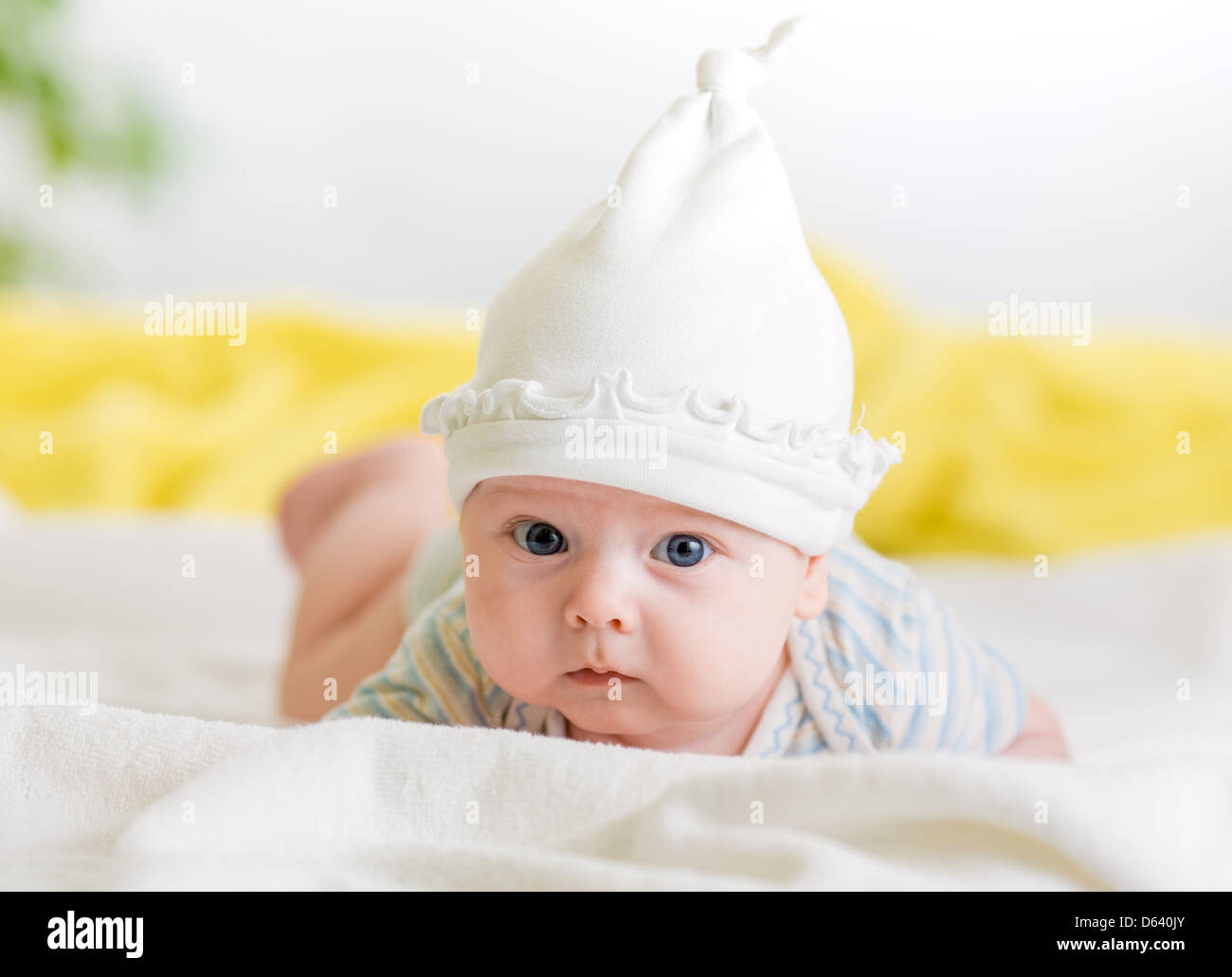 infant baby boy lying on stomach Stock Photo - Alamy