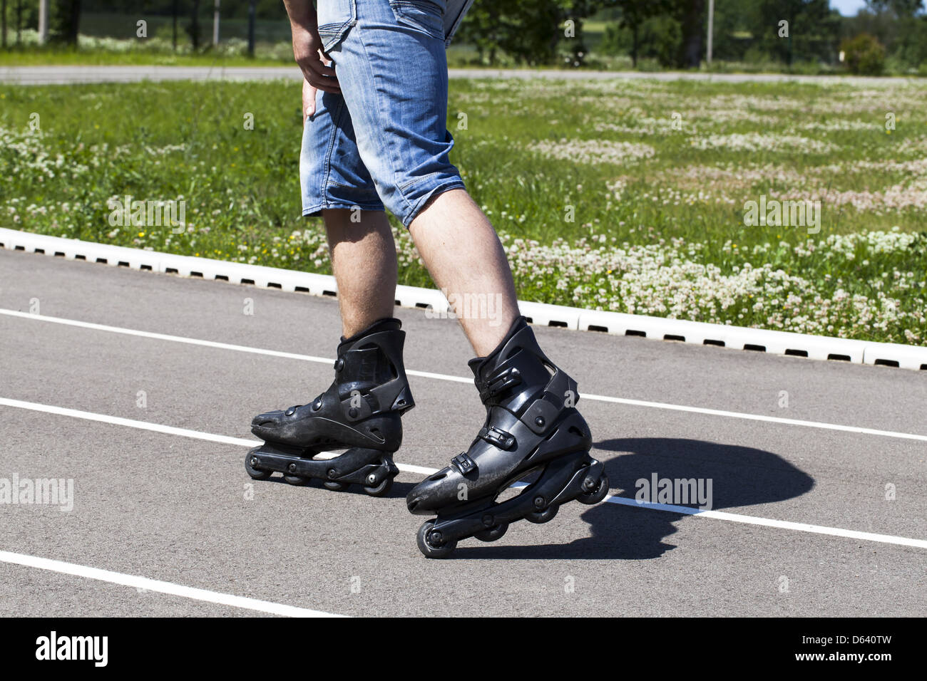 Man on roller skates in stadium Stock Photo - Alamy