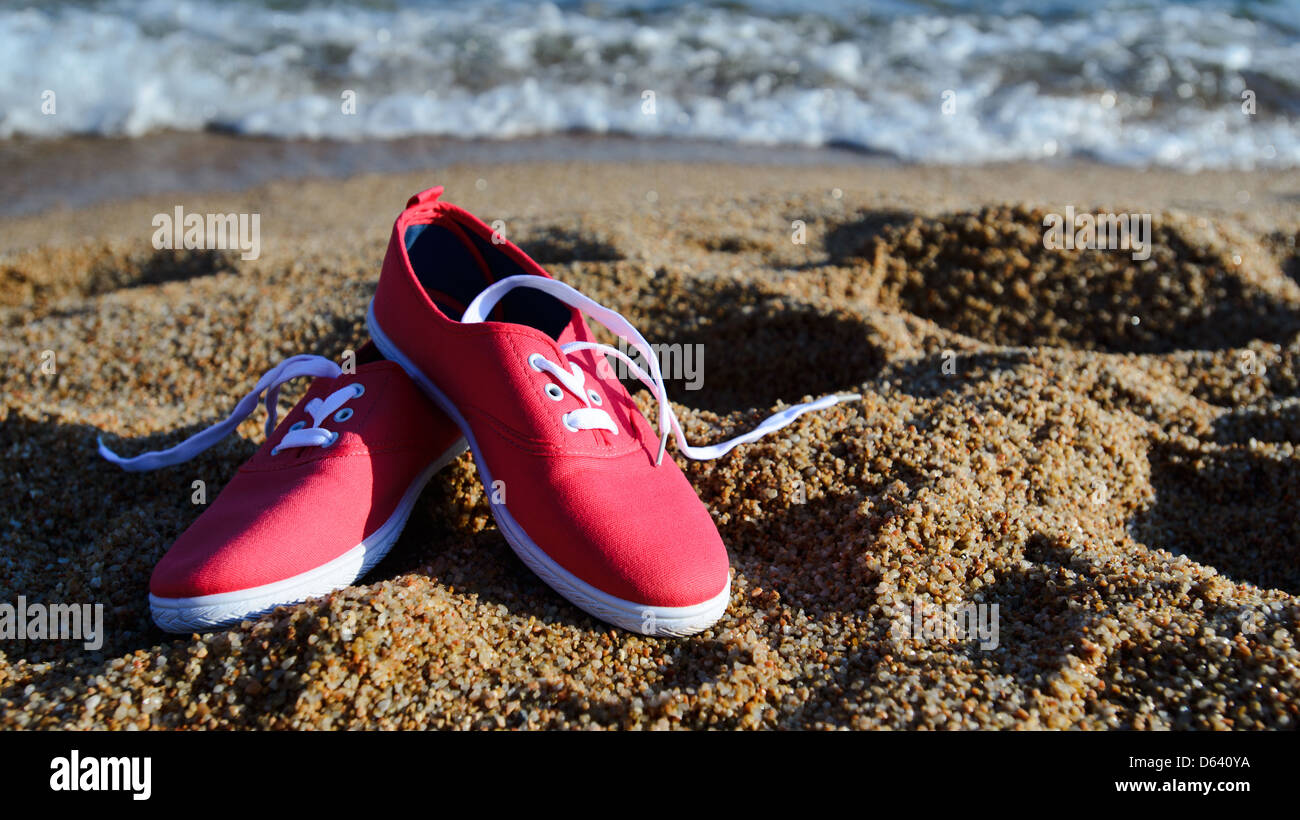 shoes on a beach Stock Photo - Alamy