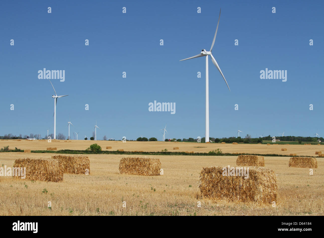 Straw bales and Windmill Stock Photo - Alamy