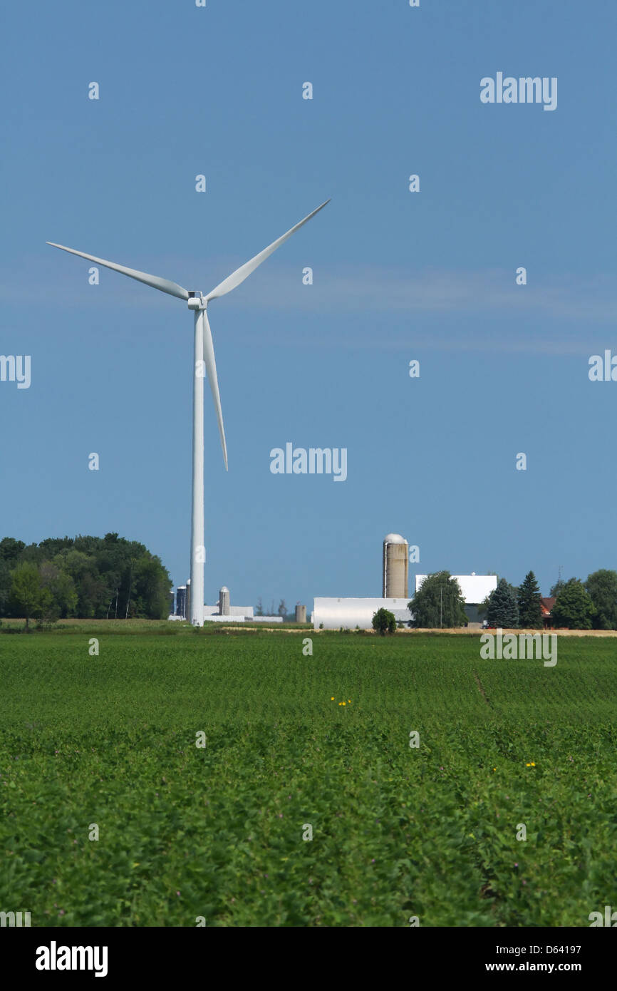 Windmill near farm barns Stock Photo - Alamy