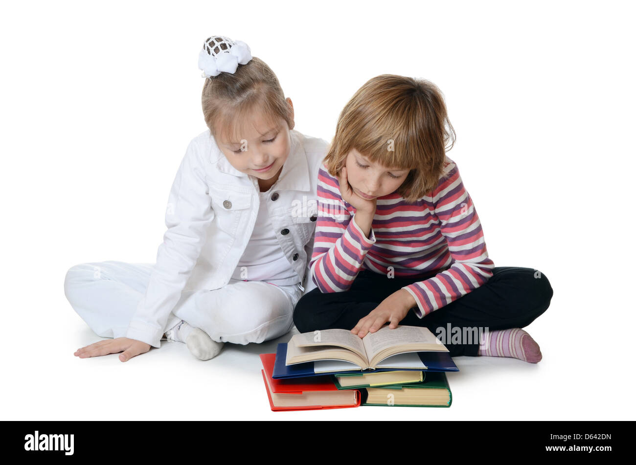 Two girls read the book Stock Photo - Alamy