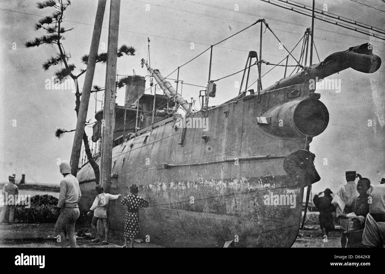 Japanese torpedo boat driven ashore shows destruction caused by a ...