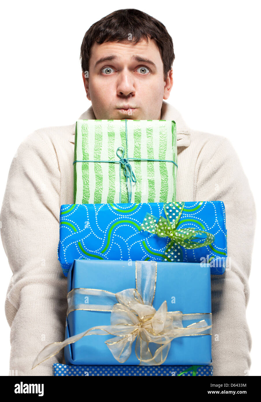 Surprised young man with presents Stock Photo - Alamy