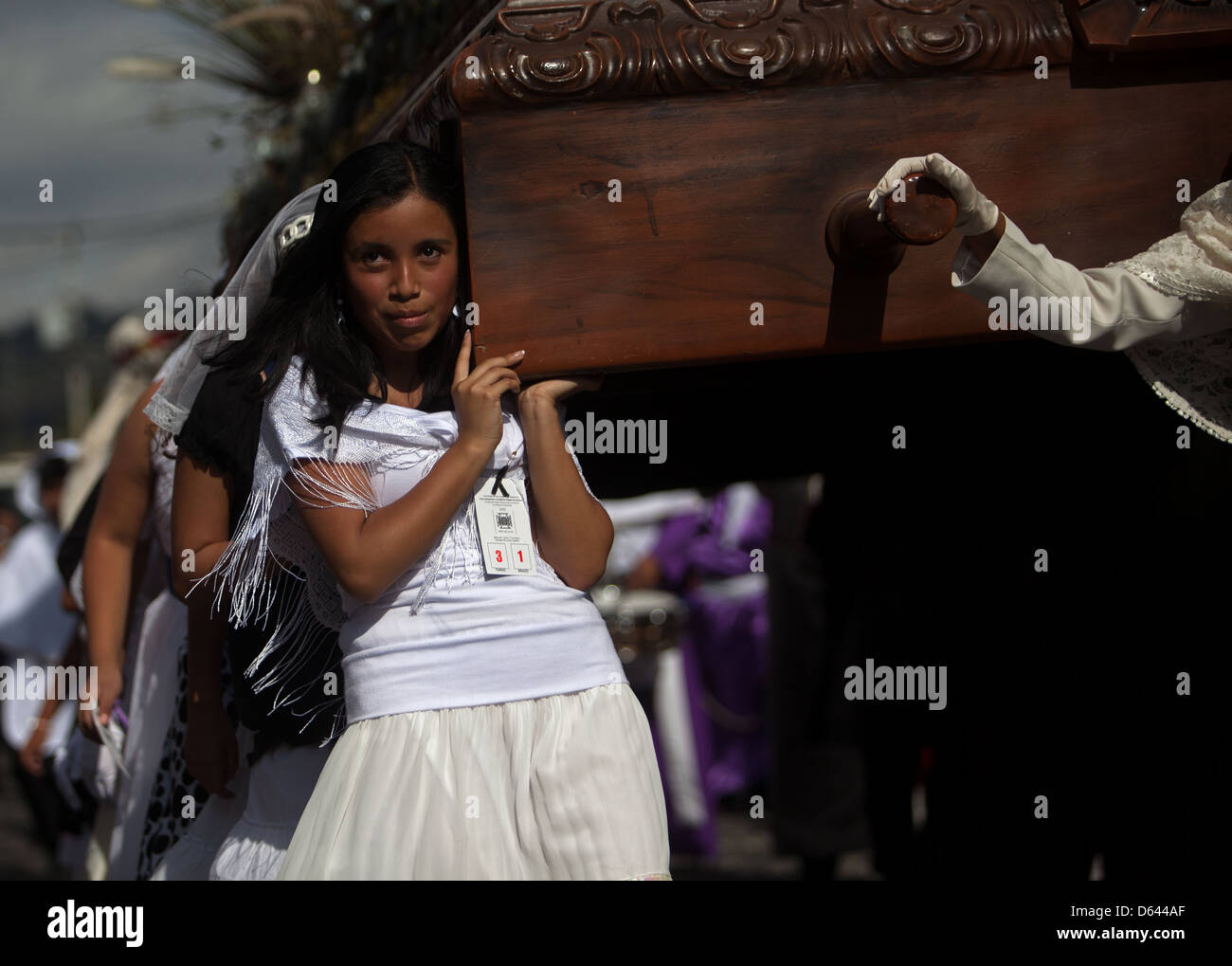 A girl carries a throne on her shoulder during La Merced's Easter Holy ...