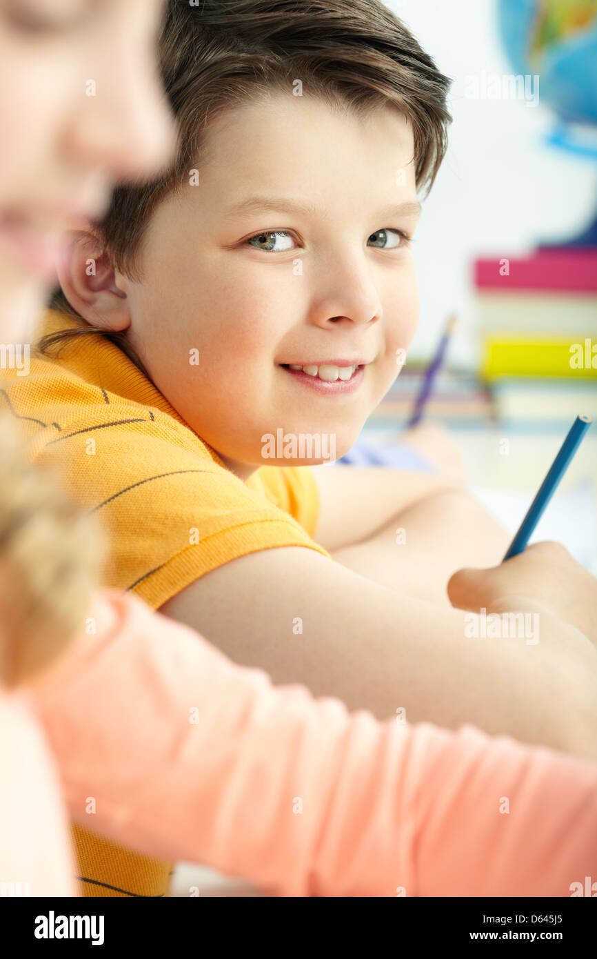 Face of smart schoolboy looking at camera at lesson Stock Photo - Alamy