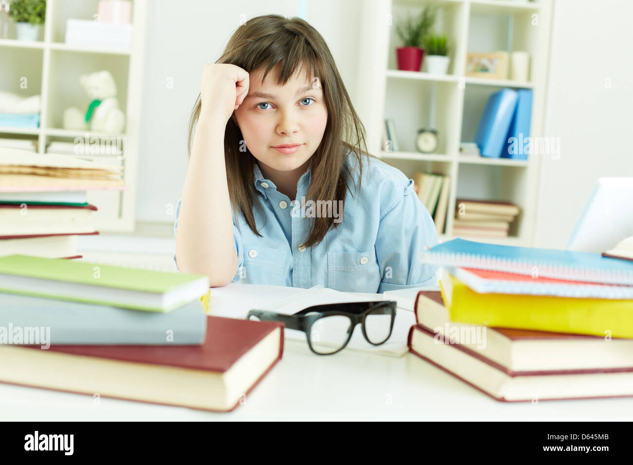 Cute girl being tired of doing homework Stock Photo - Alamy