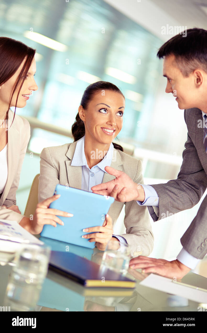 Group employees discussing something hi-res stock photography and ...