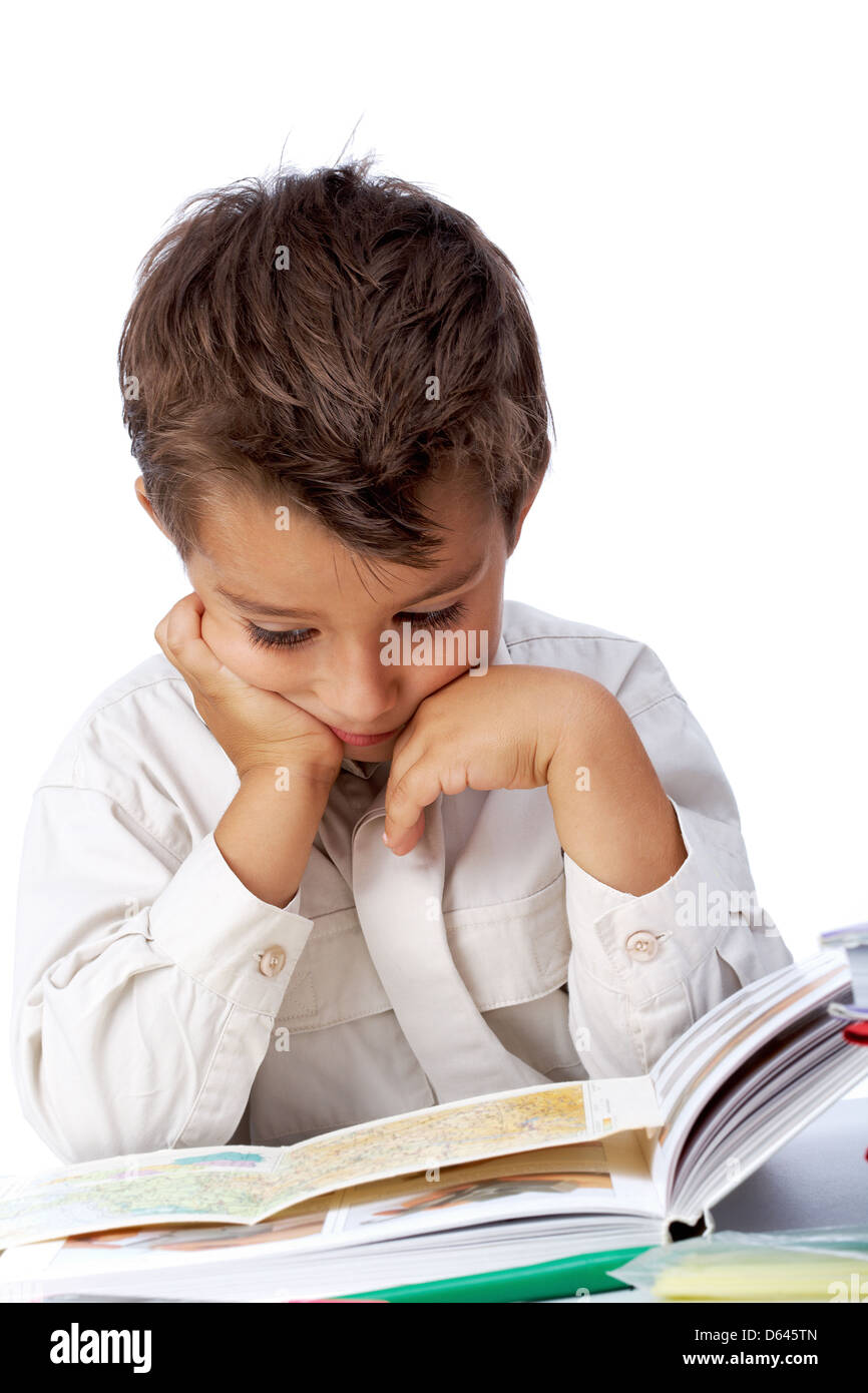 Vertical image of interested schoolkid reading book in isolation Stock ...