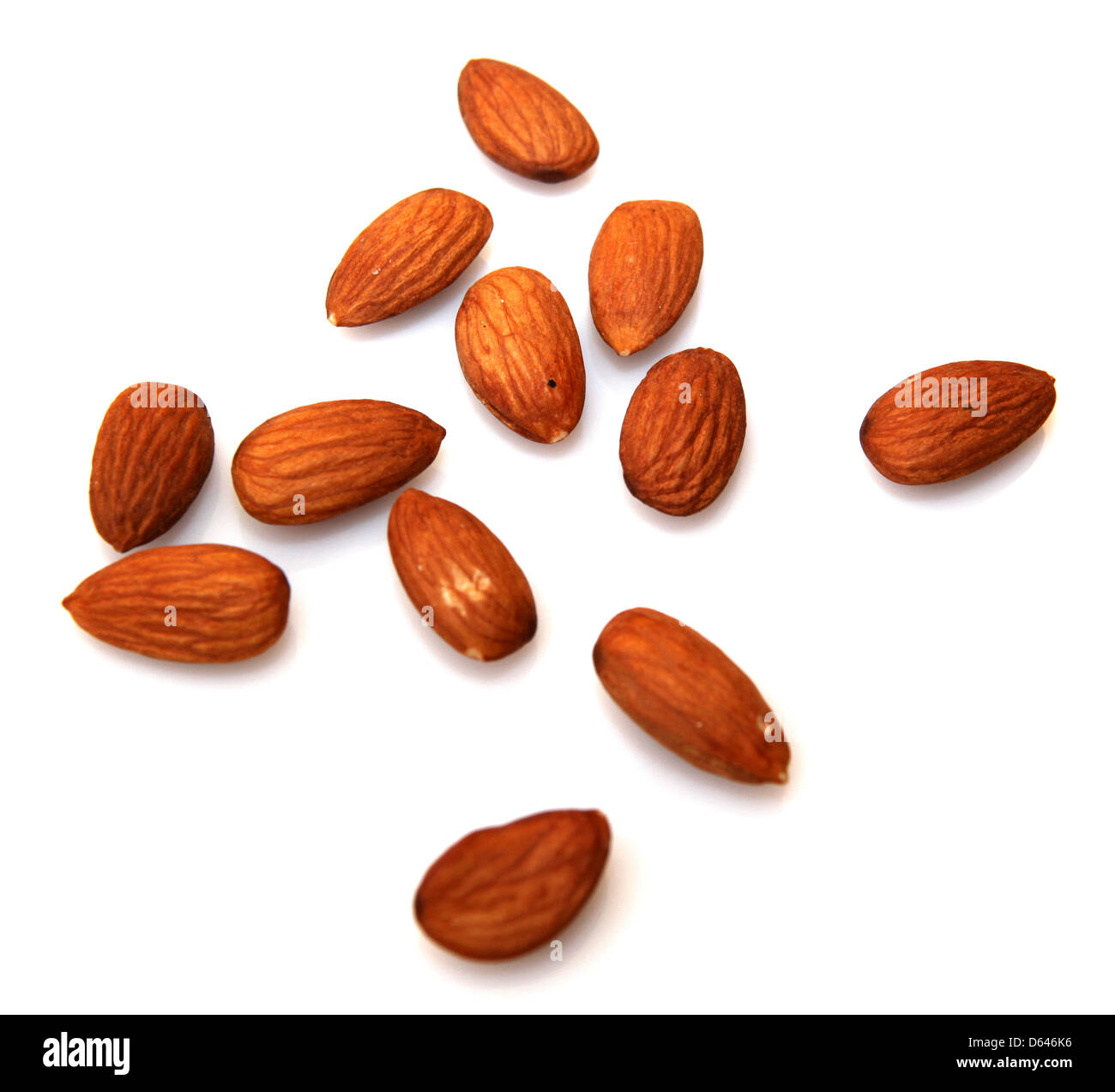 Almonds isolated on white background Stock Photo - Alamy