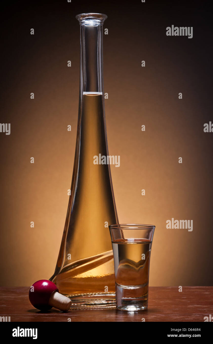 still life with shot and bottle of traditional brandy Stock Photo - Alamy