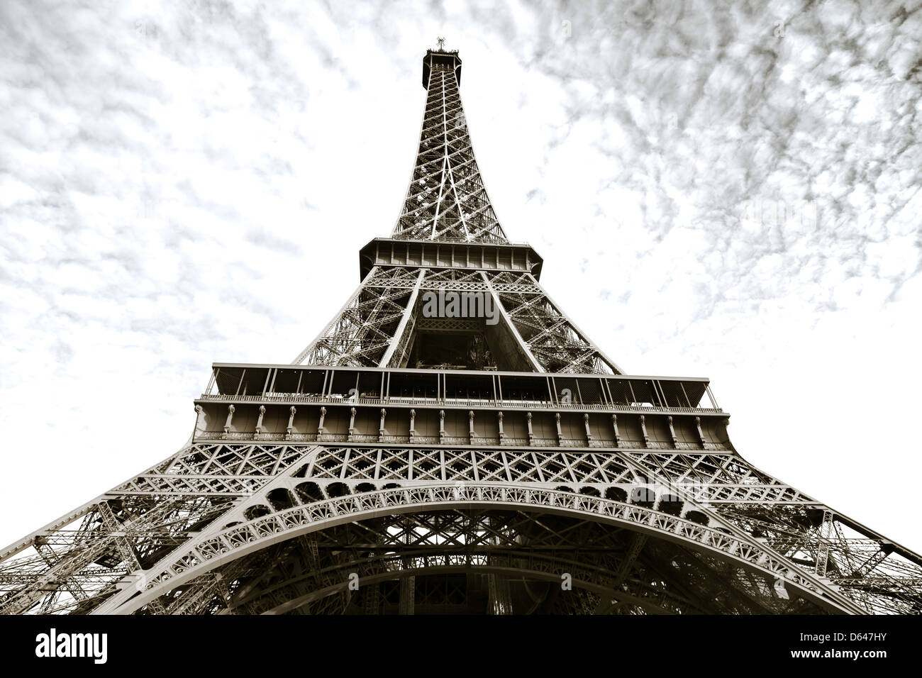 Eiffel tower in Paris with grey clouds bottom view Stock Photo - Alamy