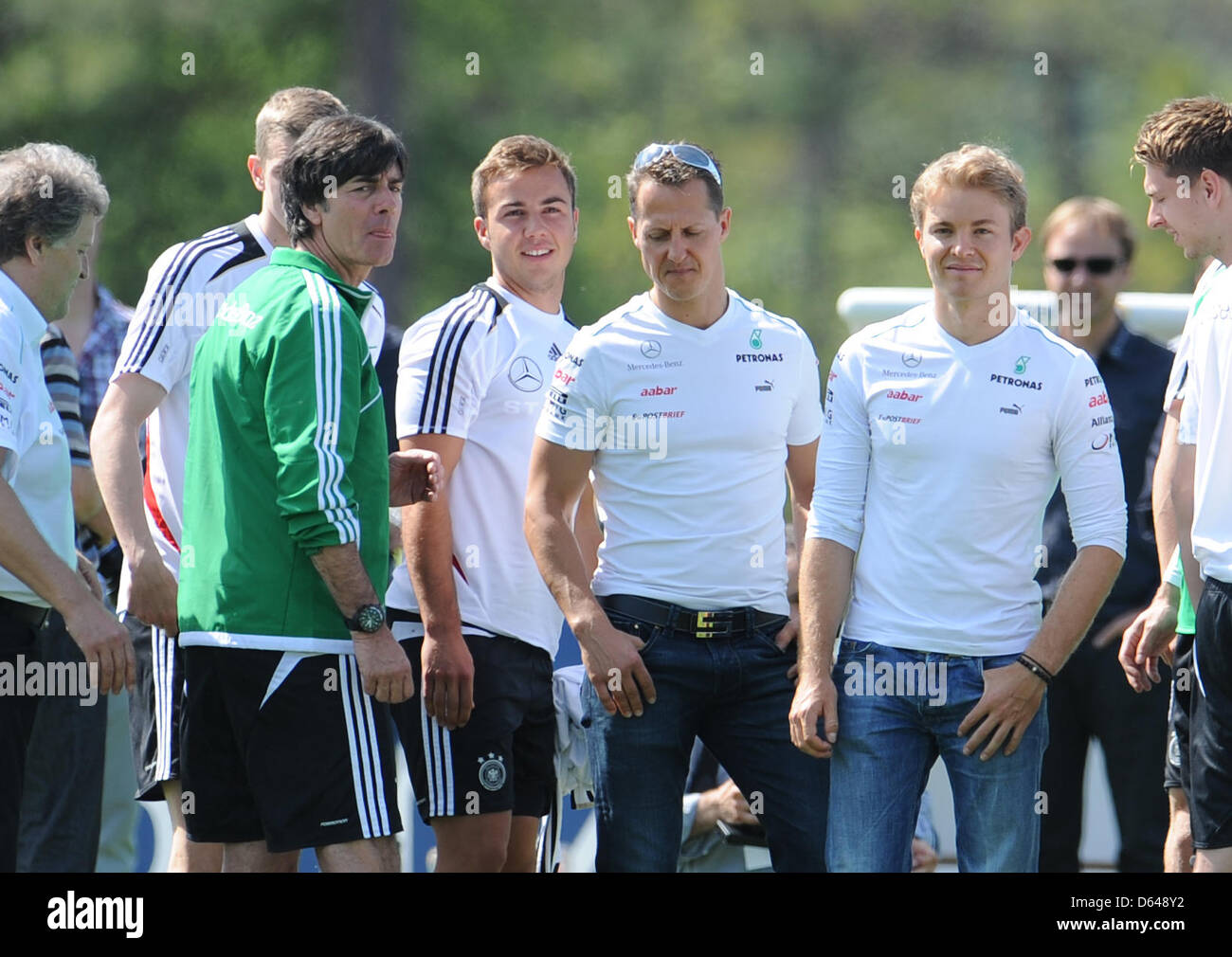 German Formula One racing drivers Michael Schumacher (4-R) and Nico ...