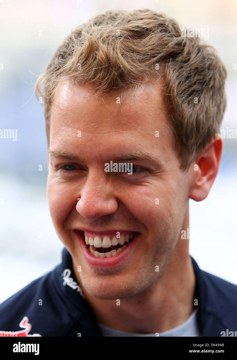 German Formula One driver Sebastian Vettel of Red Bull walks through ...