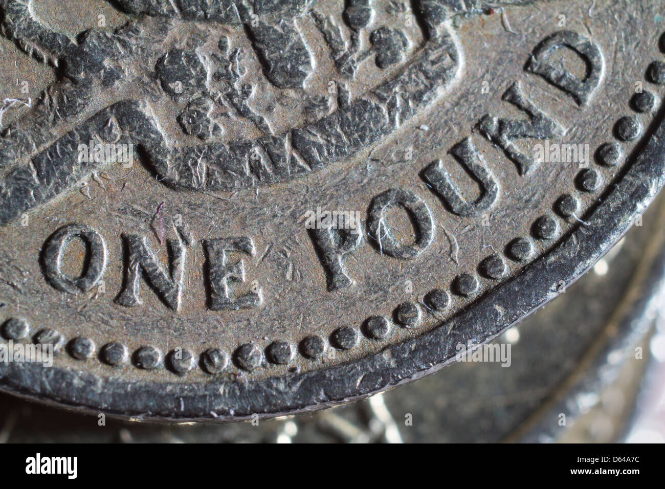 A detailed view of a one-pound sterling coin, the standard unit of ...