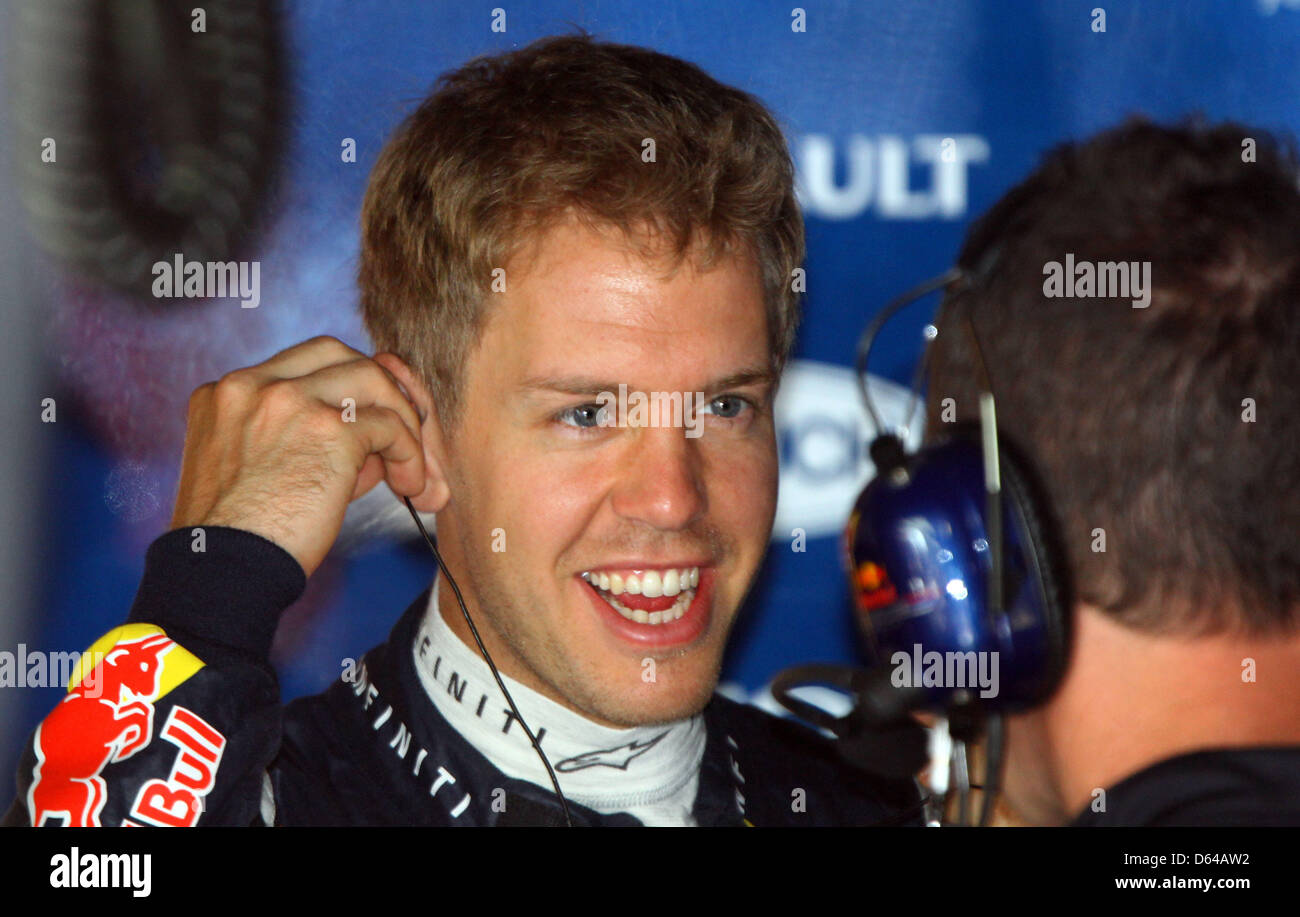 German Formula One driver Sebastian Vettel of Red Bull laughs in his ...