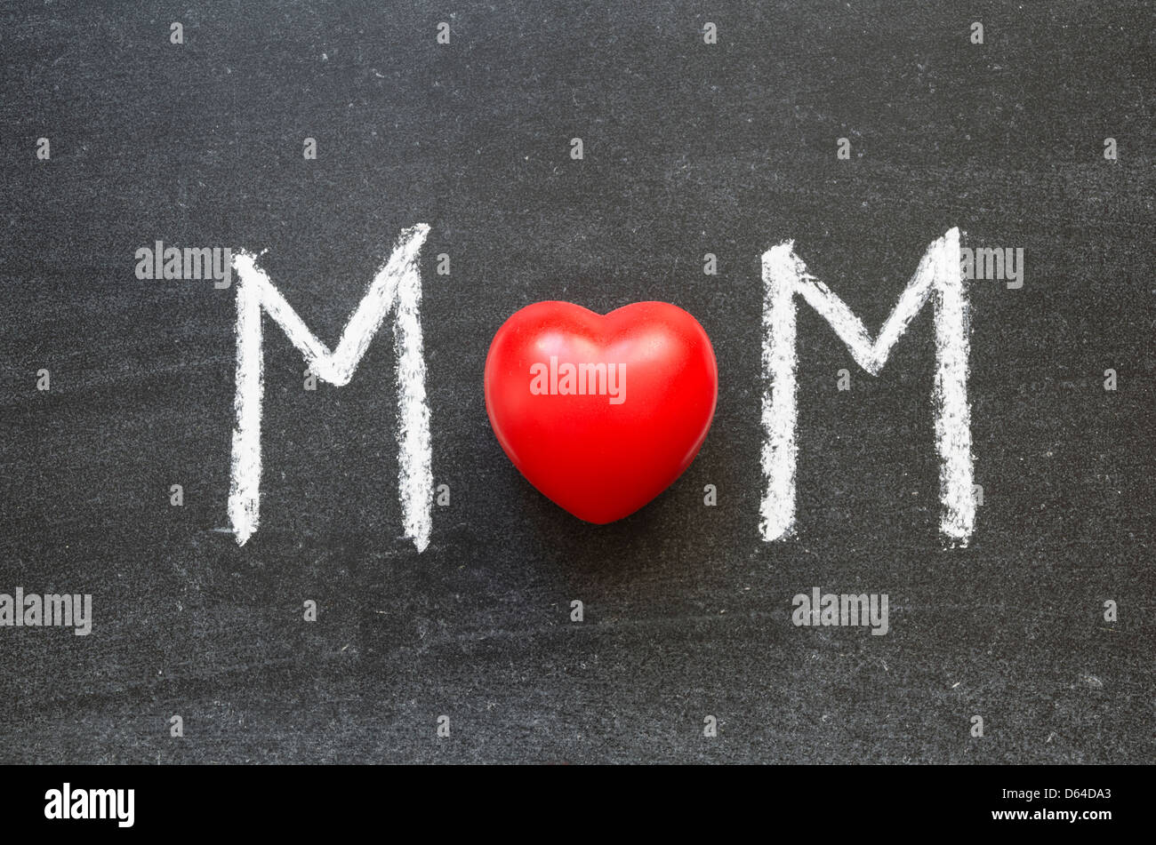 MOM word handwritten on the school blackboard with red heart as O ...