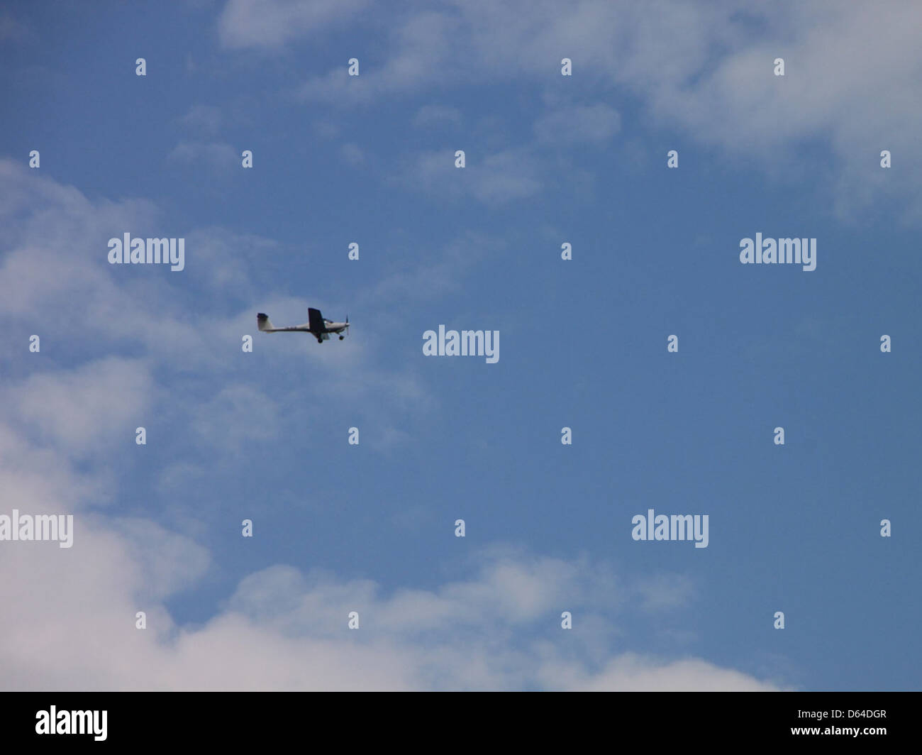 A small propeller plane in flight, showcasing its design and ...