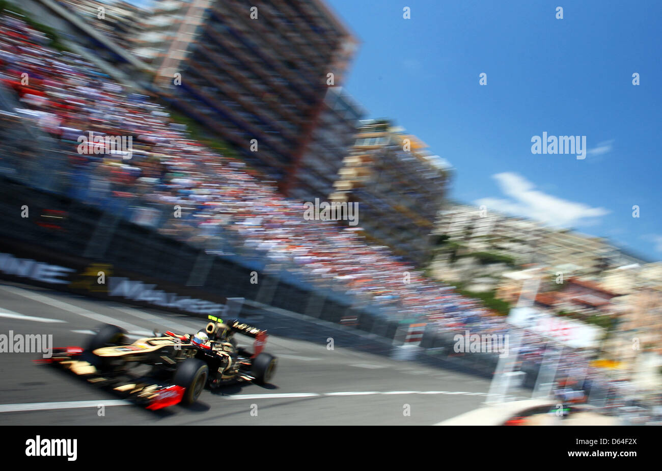 French Formula One driver Romain Grosjean of Lotus steers his car ...