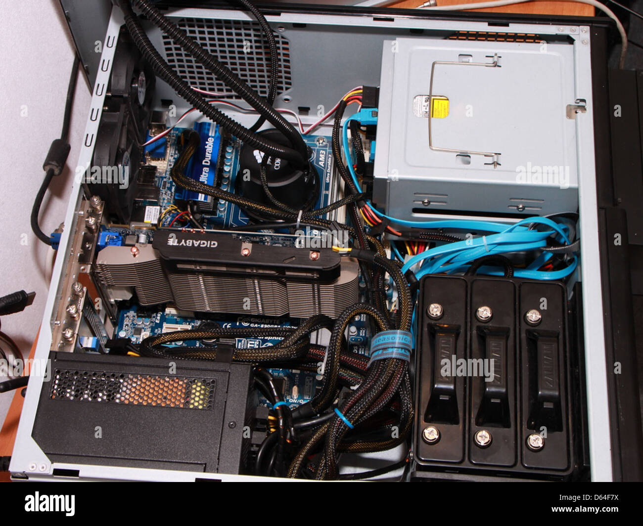 An inside view of a computer case showing components like the ...