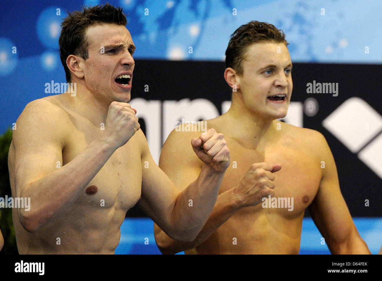 Germany's Paul Biedermann and Dimitri Colupaev react during the 4x200 ...