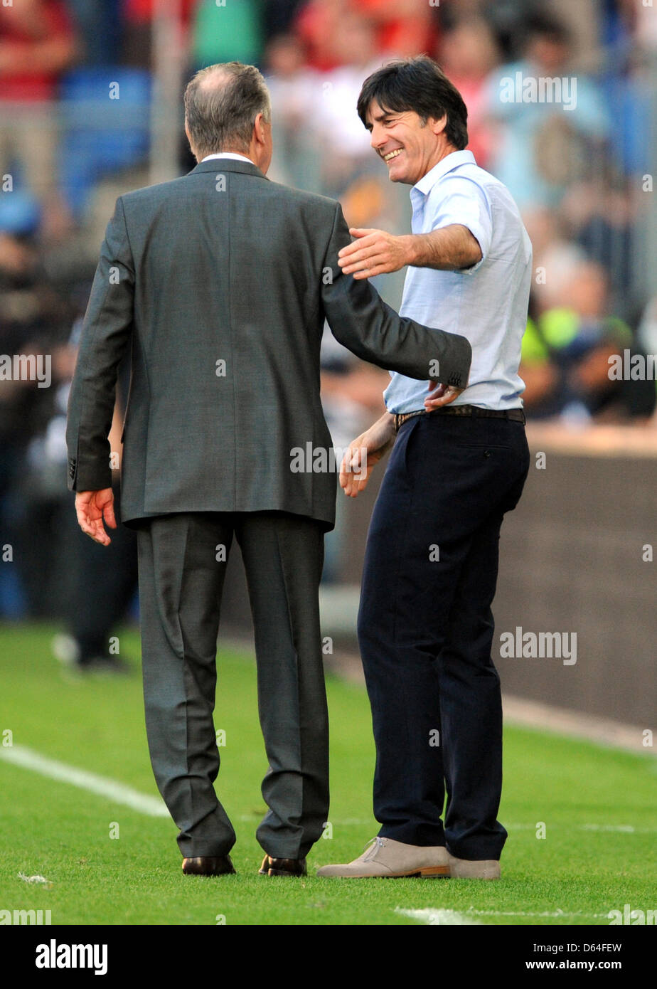 German's coach Joachim Loew (r) congratulates coach Ottmar Hitzfeld ...
